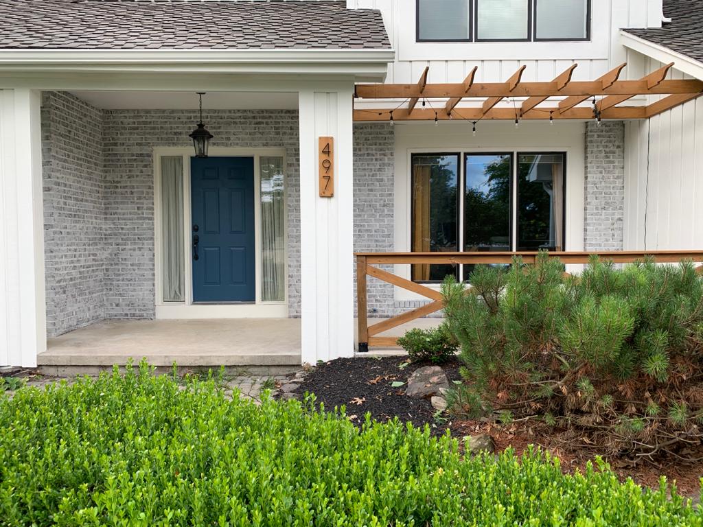 How to Whitewash Exterior Brick Easily - Design by Made In Casita